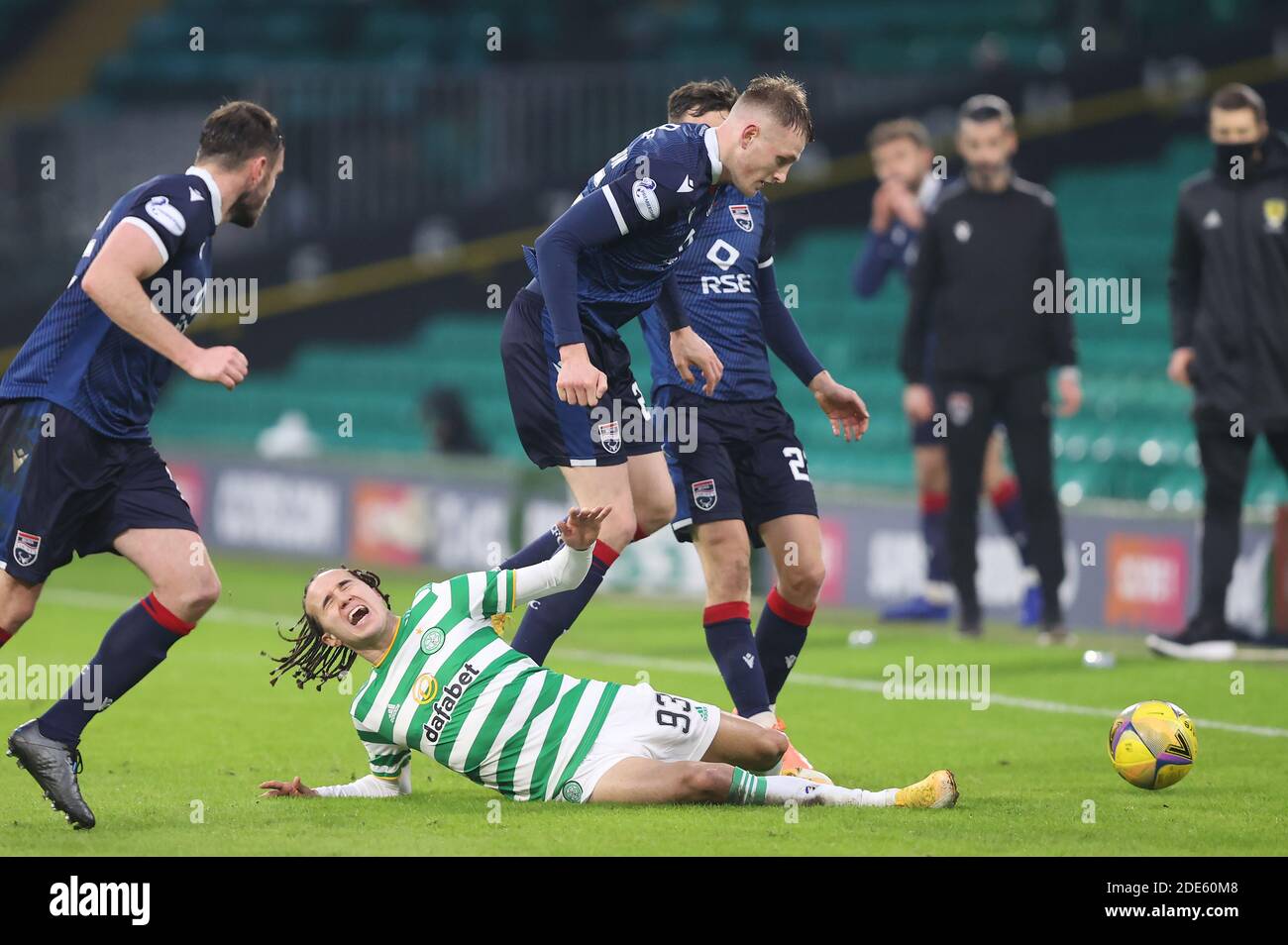 Celtic's Diego Laxalt (left) and Ross County's Coll Donaldson in action ...