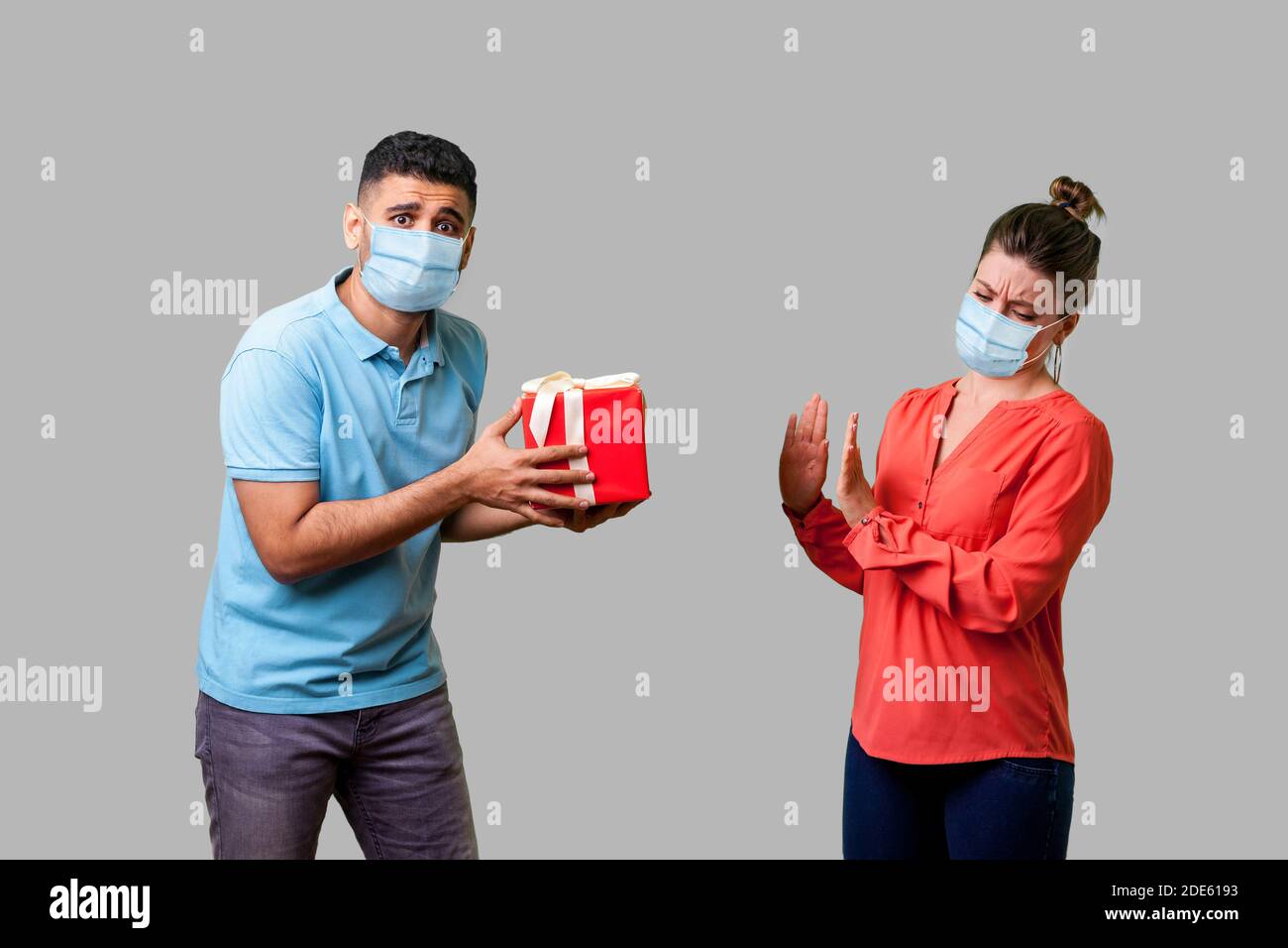 Portrait of upset resentful man with surgical medical mask giving ...