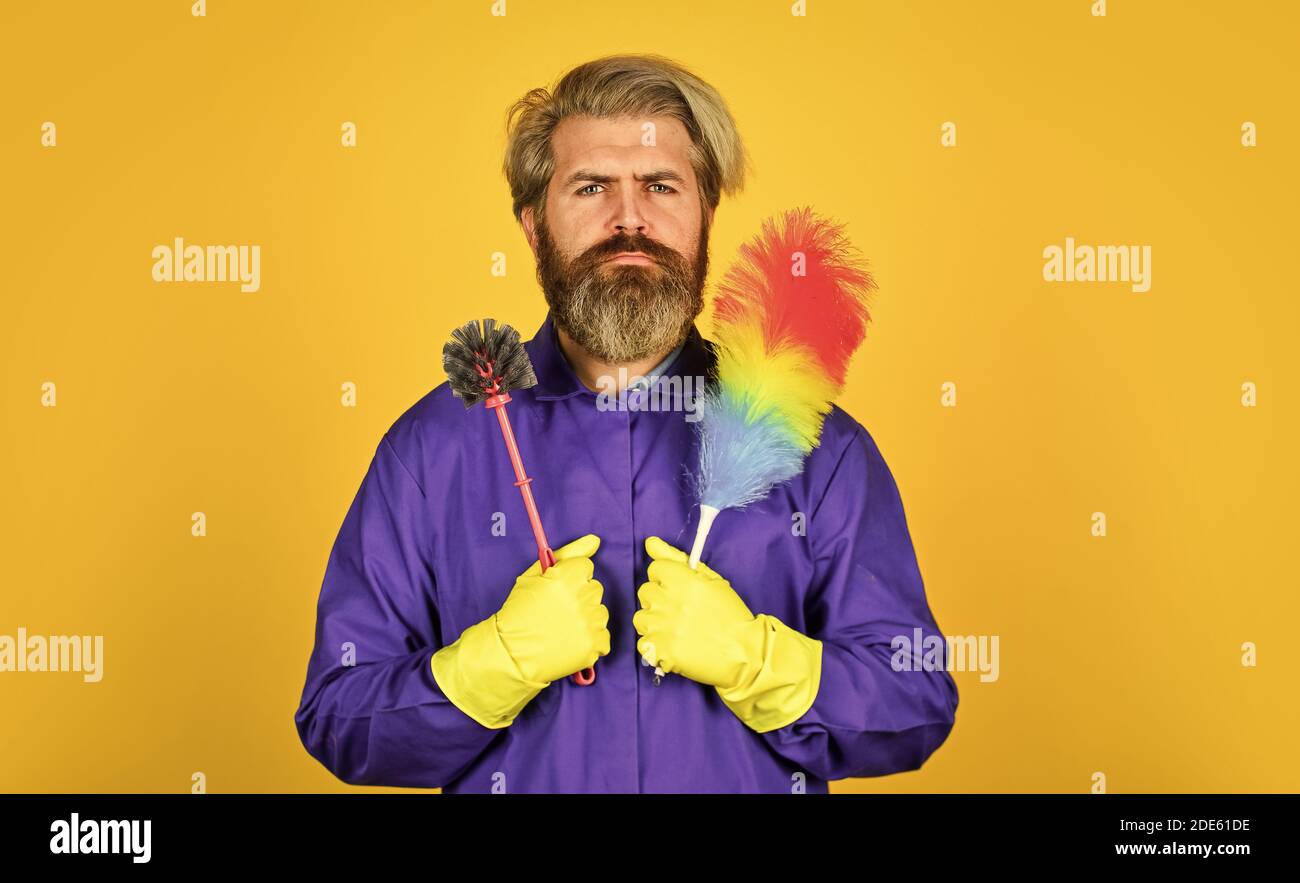 Cleaning apartment. Man use pp duster. Dust allergy. Husband cleaning ...