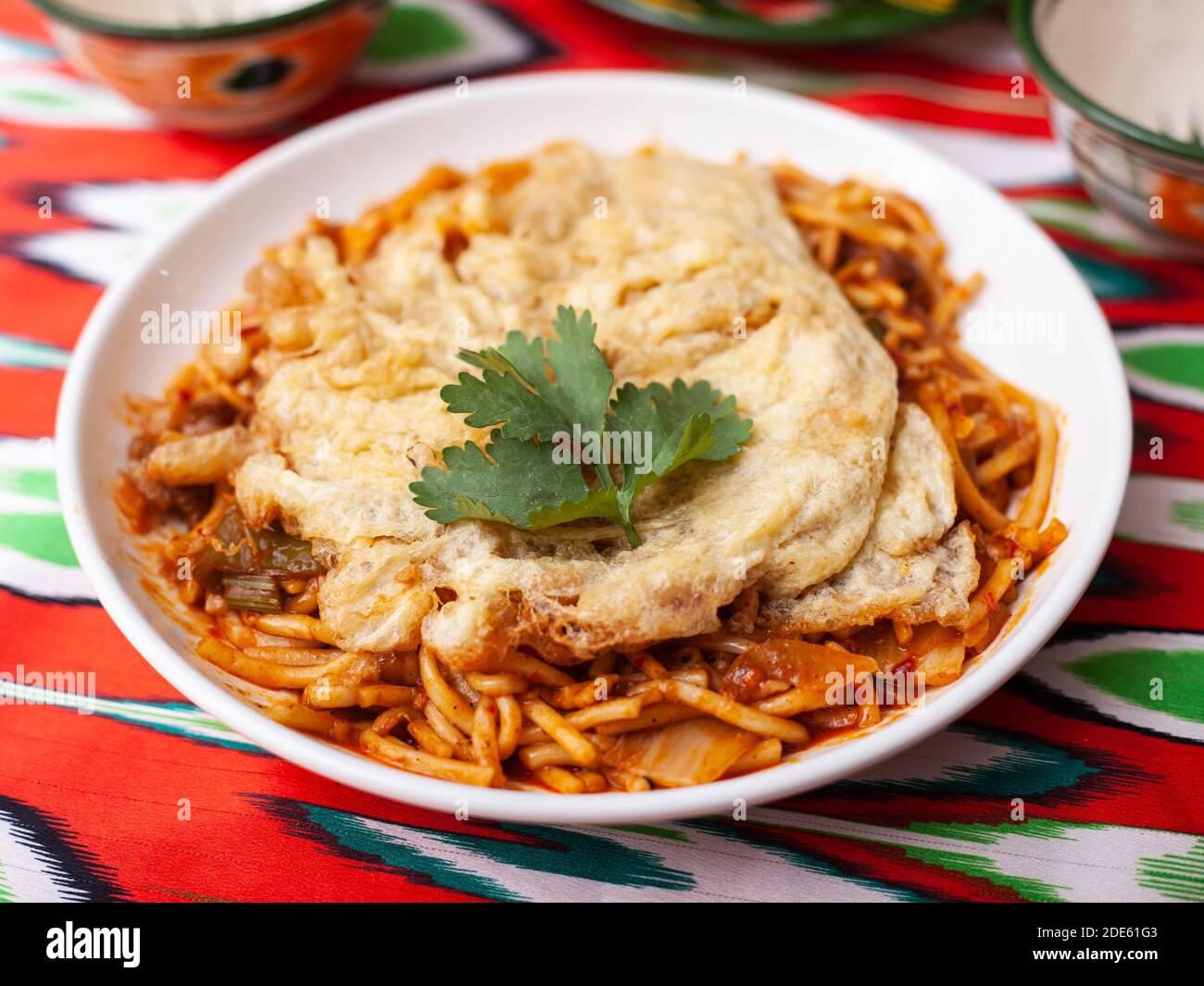 The oriental lagman dish is homemade noodles fried with meat ...