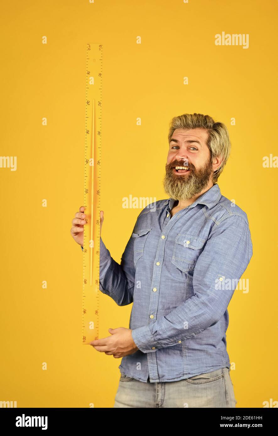 Teaching geometry. Long or short. Bearded man use ruler. Education ...