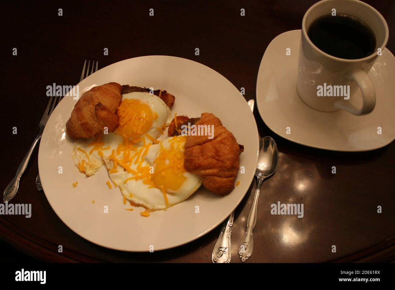 It looks like an open face sandwich; the toasted croissant was sliced ...