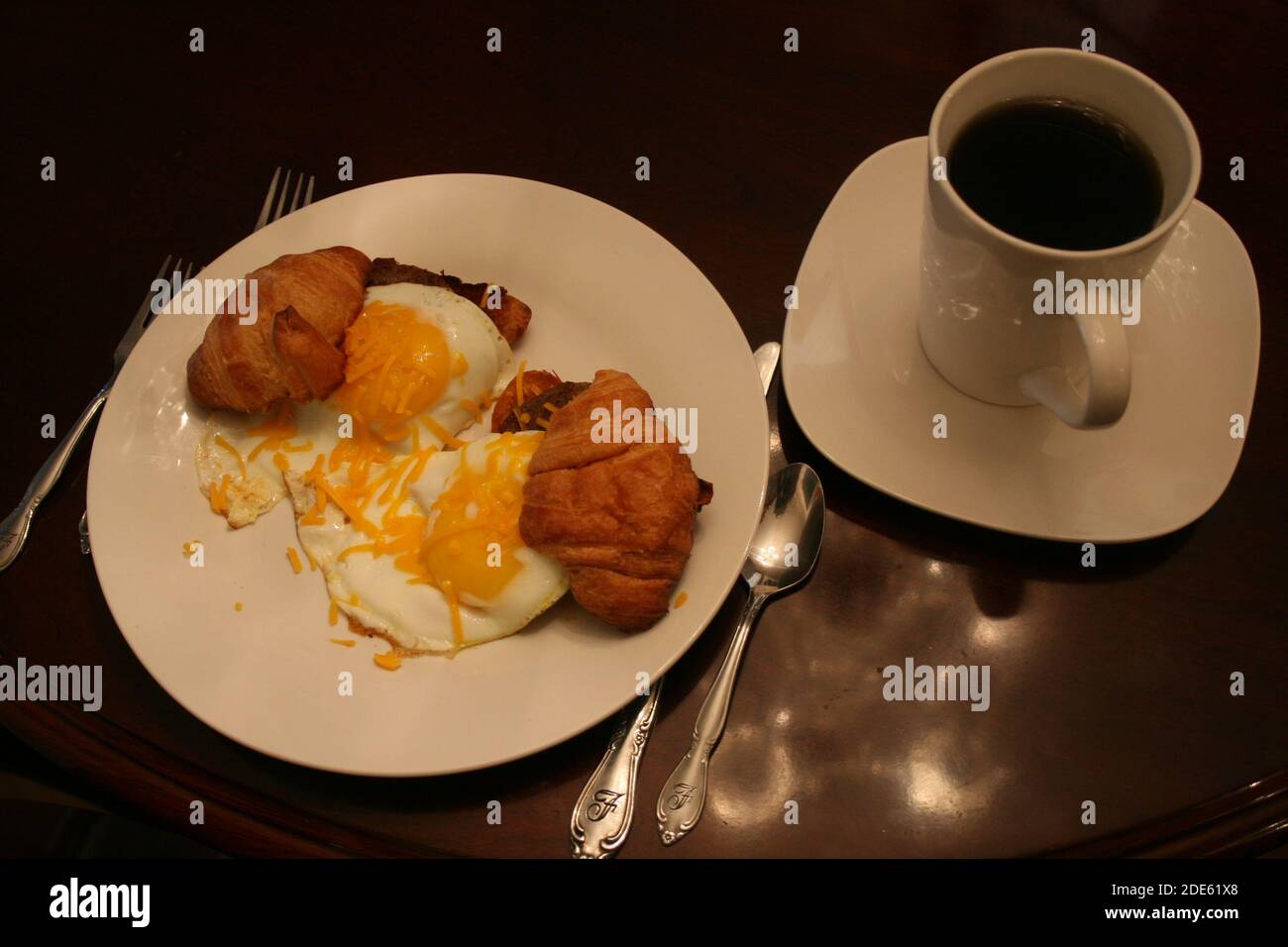 It looks like an open face sandwich; the toasted croissant was sliced ...