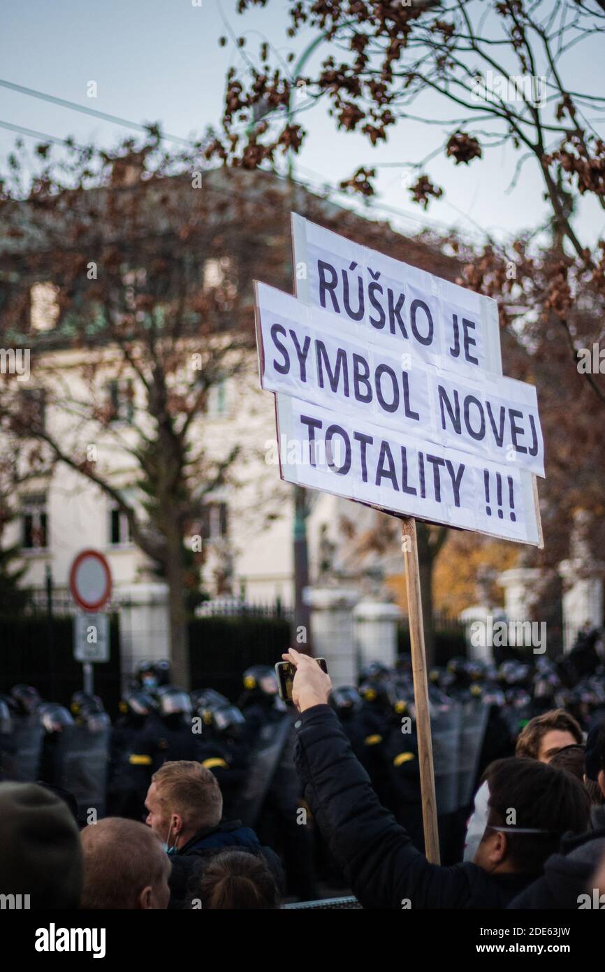 Crowd of people with rude signs and armed police officers on Slovak ...