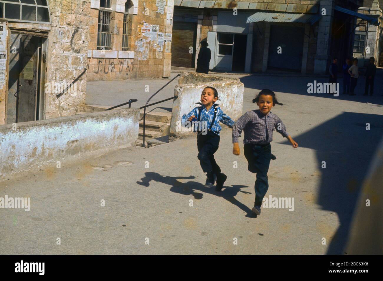 Israel ; Orthodox boys running in the old city of Jerusalem Stock Photo ...