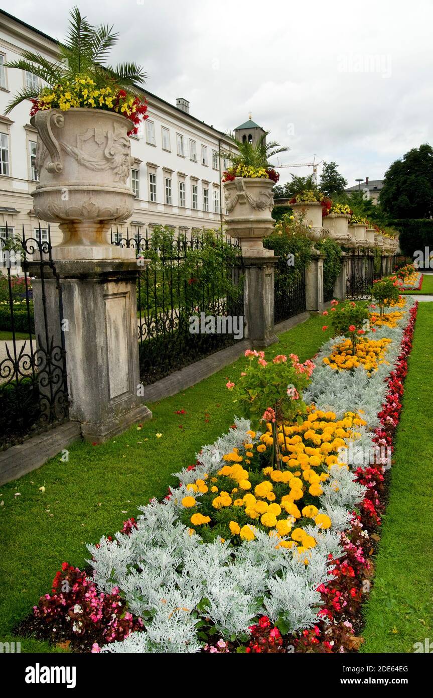 Flower Beds In Bloom Alongside Mirabell Palace In The Mirabell Gardens ...