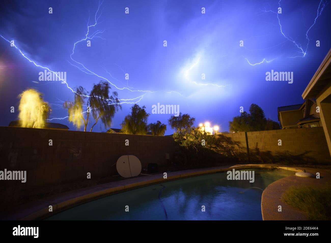 Amazing Thunders storm over a pool in the backyard of a house Stock ...