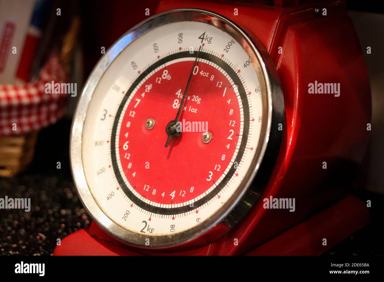 Red weighing scales Stock Photo - Alamy