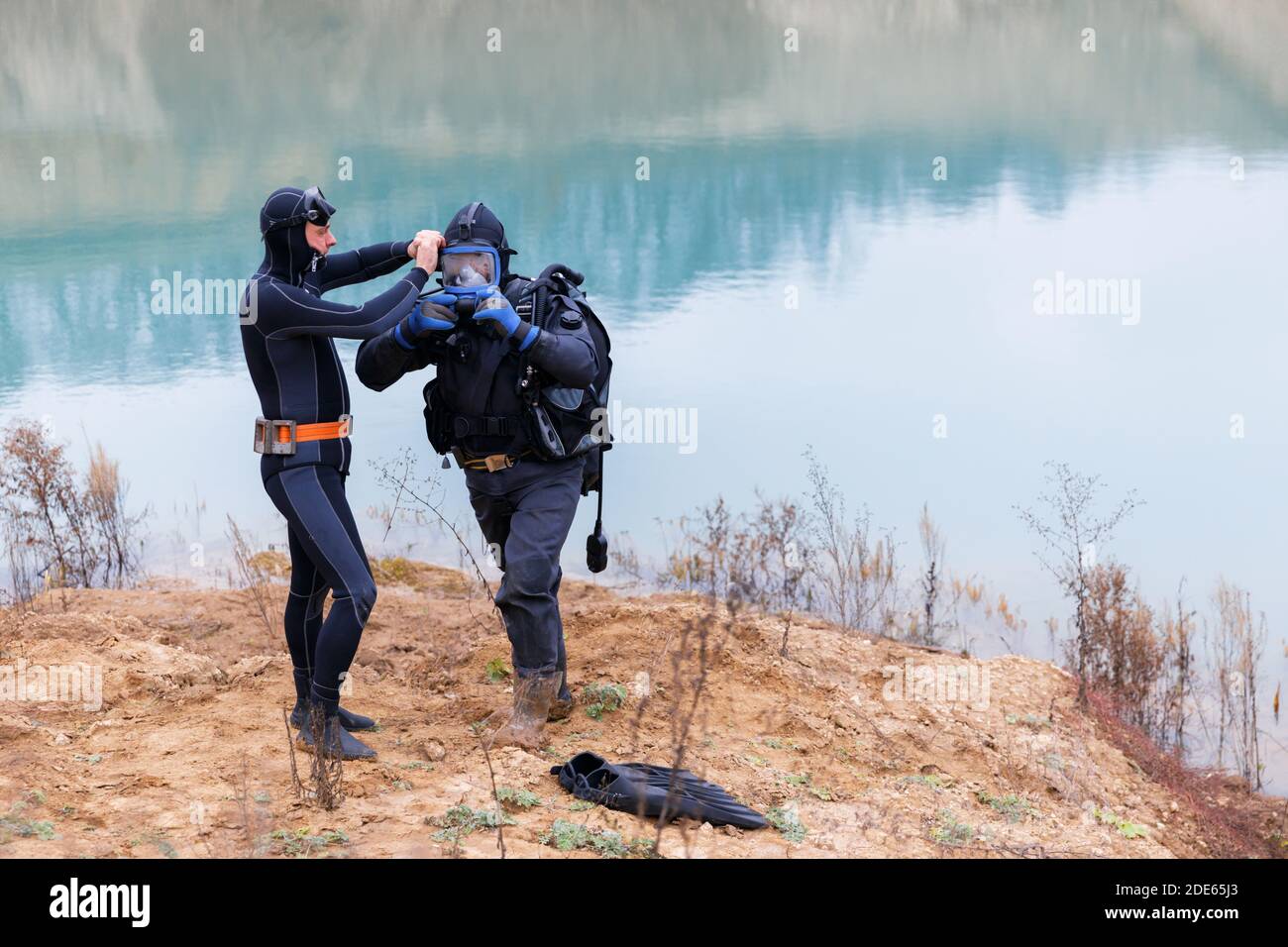 Lifeguard in a wetsuit to work underwater. Search at the bottom of the ...