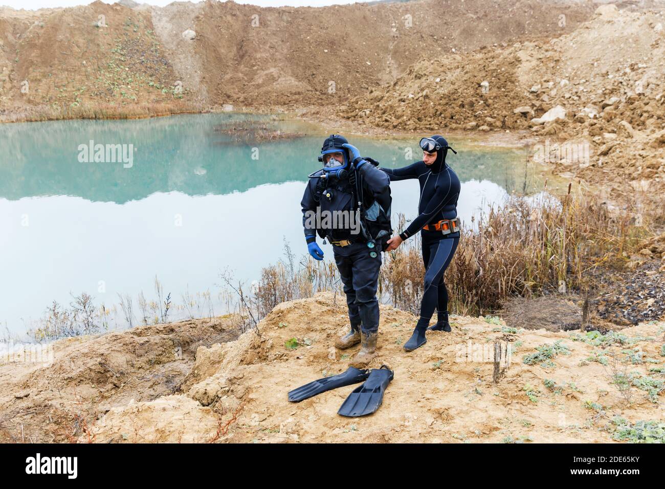 Lifeguard in a wetsuit to work underwater. Search at the bottom of the ...