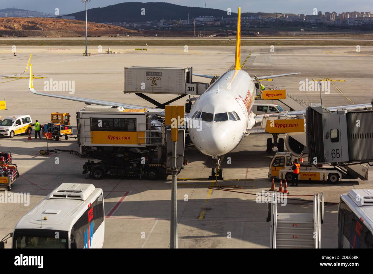 Airbus A320 type airliner parked in service area with ambulift ...