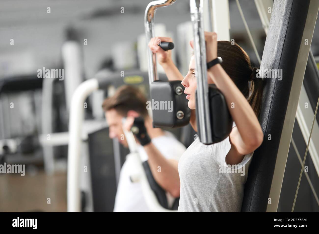 Beautiful athletic woman training at gym Stock Photo - Alamy