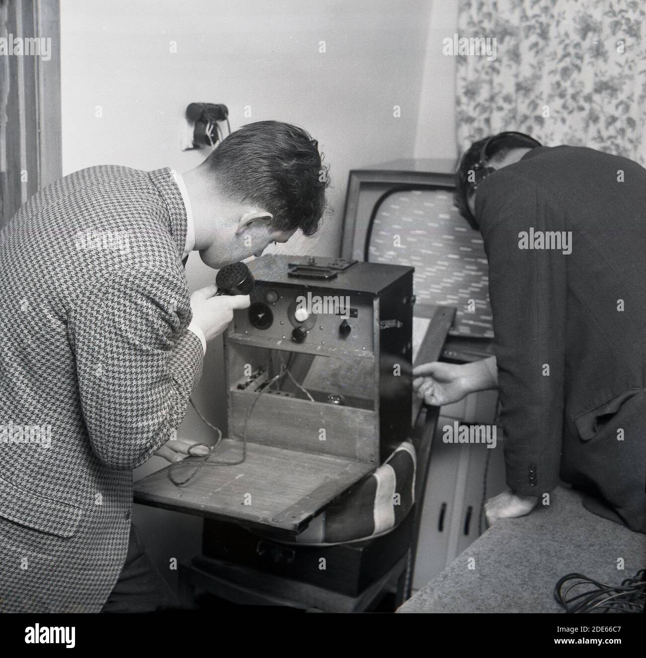 1960s, historical, Pirate radio...inside a room in a house, three males ...