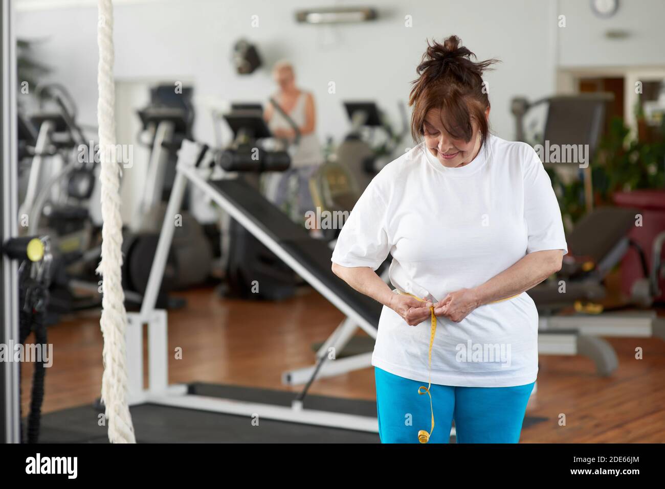 Senior woman measuring body hi-res stock photography and images - Alamy