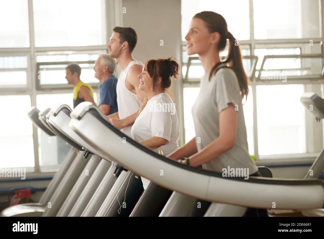 People on treadmill at gym Stock Photo - Alamy
