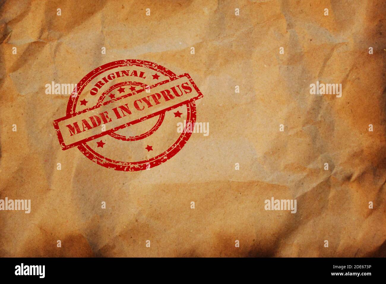 Made in CYPRUS stamp printed on crumpled sheet of burnt paper. Cyprian ...