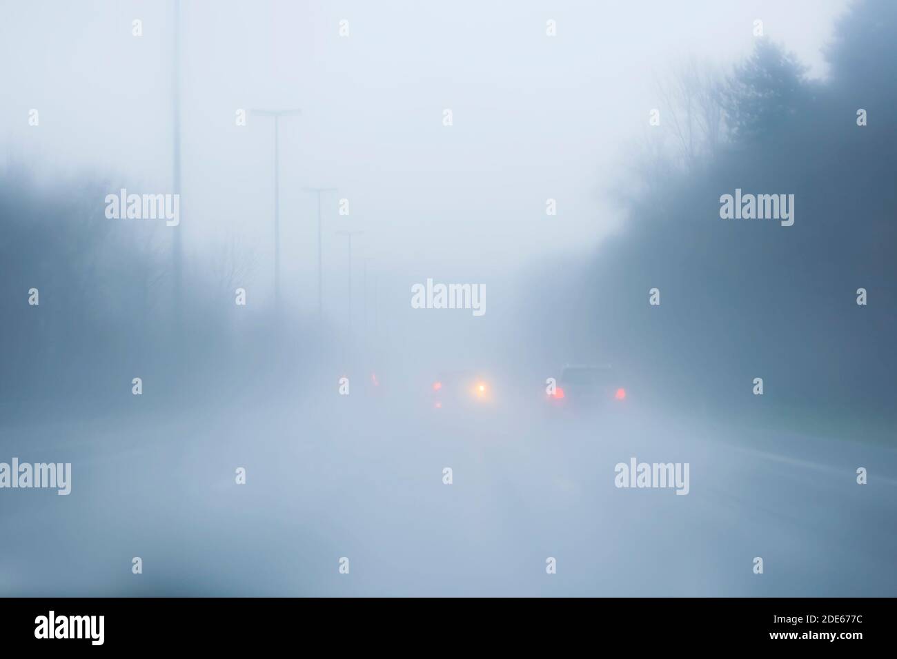 Driving with fog and rain Stock Photo - Alamy