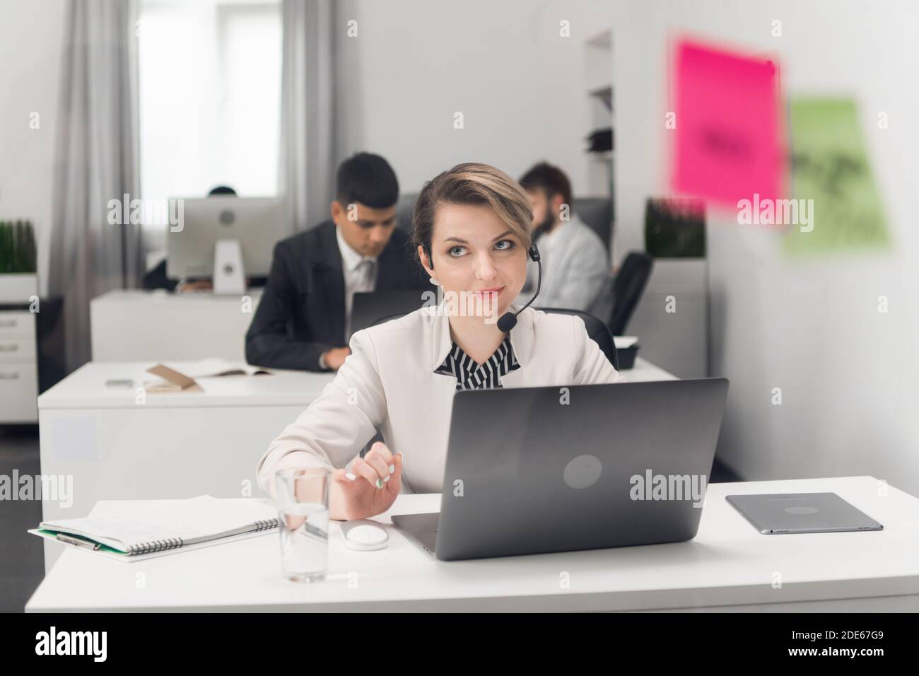 A young girl Manager in the office in a working dress code with a ...