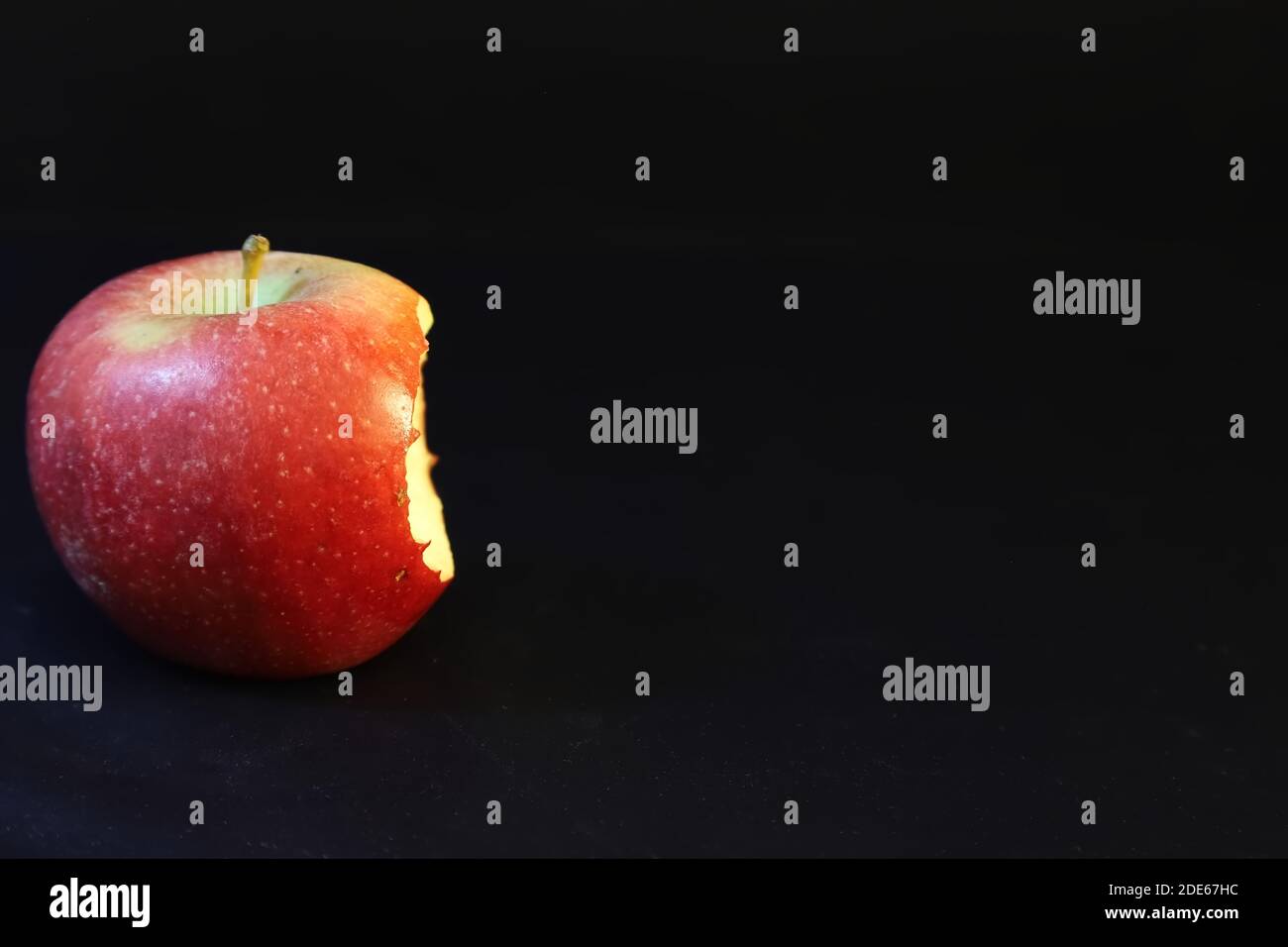 an apple with a bite Stock Photo - Alamy