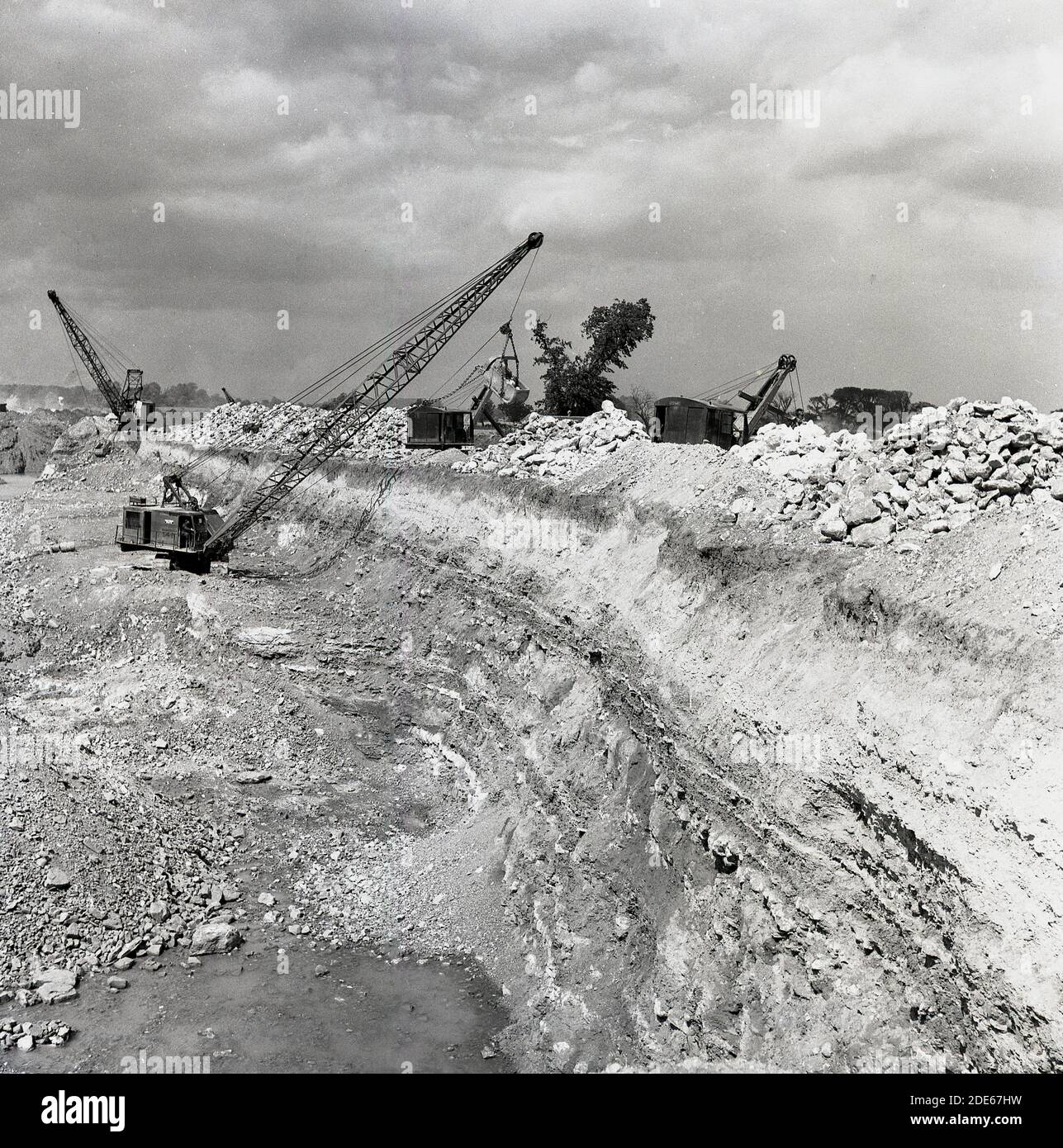 1950s, historical, mining, picture shows a large stone or rock quarry ...