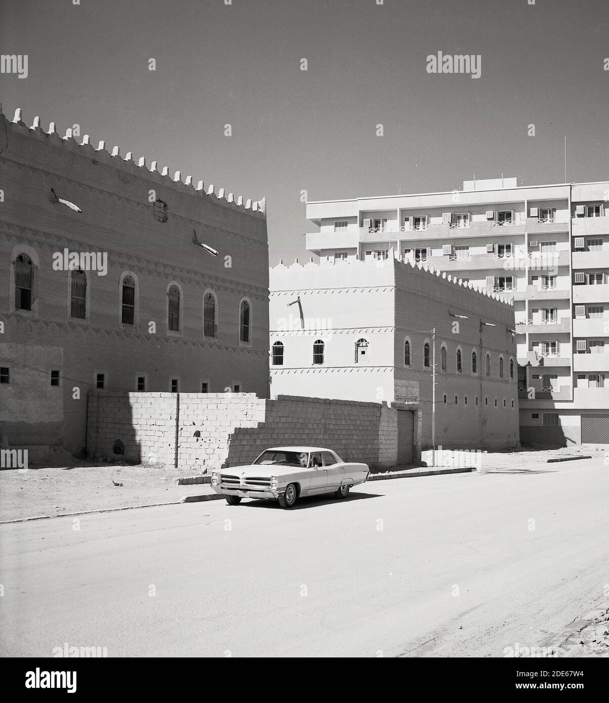 1960s, historical, an imported American automobile parked on an empty ...