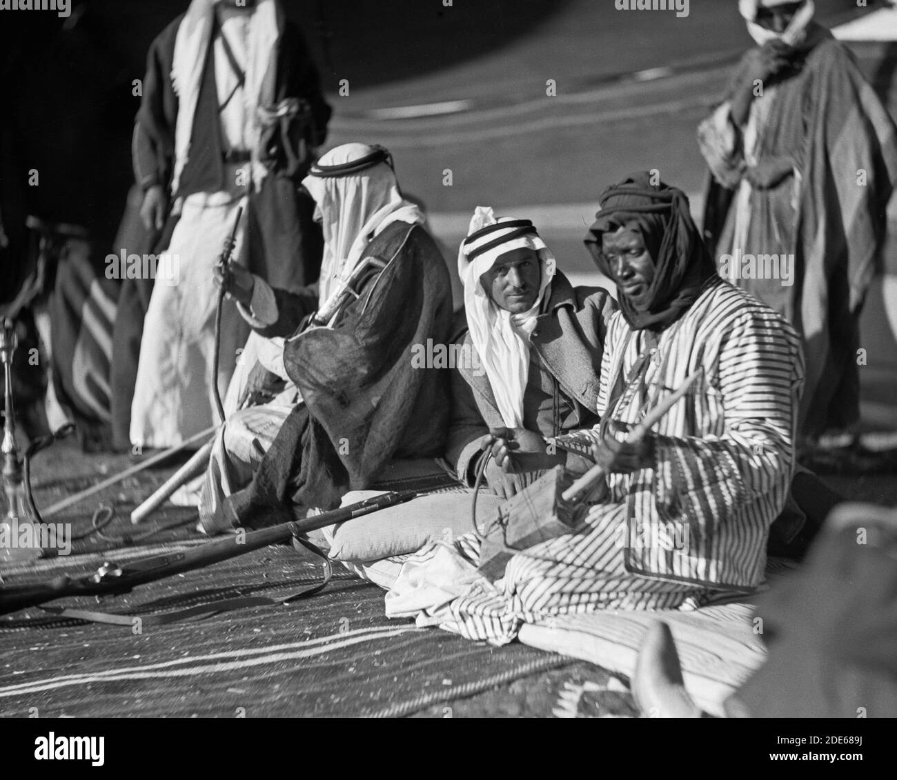 Bedouin life in Trans-Jordan. The chief entertainer. A black minstrel ...
