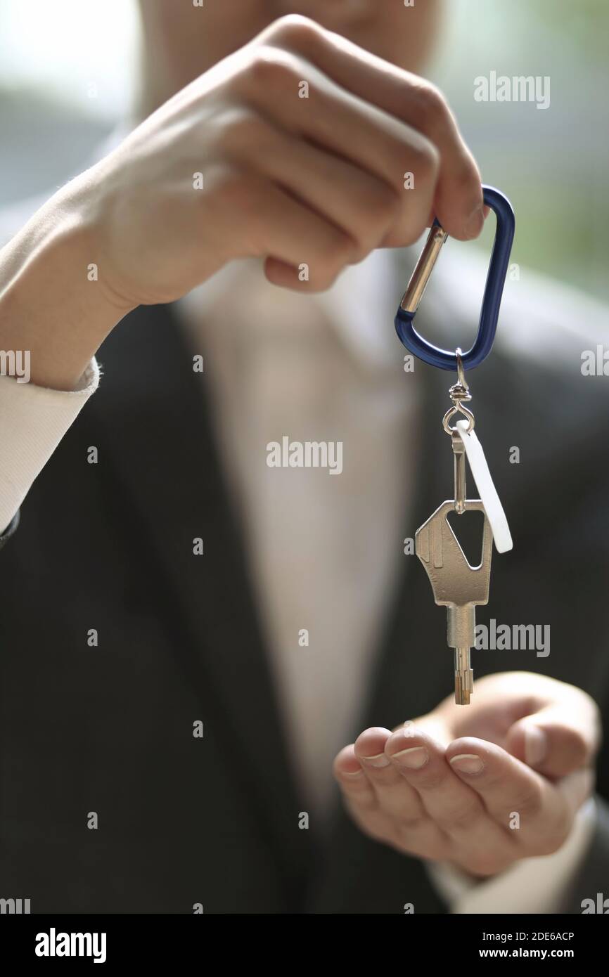 Businessman holding key hi-res stock photography and images - Alamy