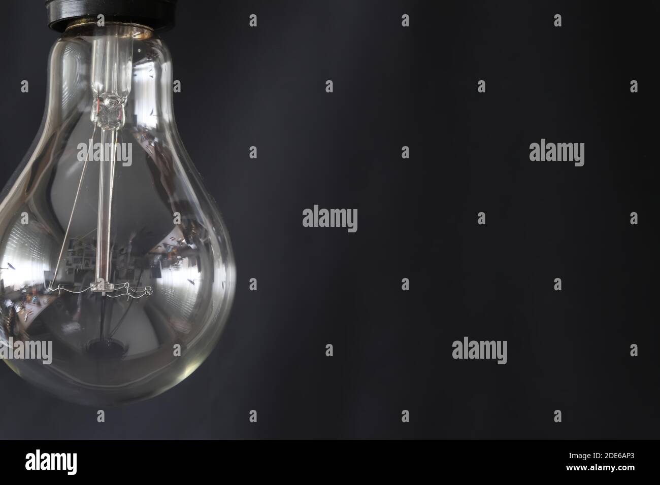 clear light bulb on black background Stock Photo - Alamy
