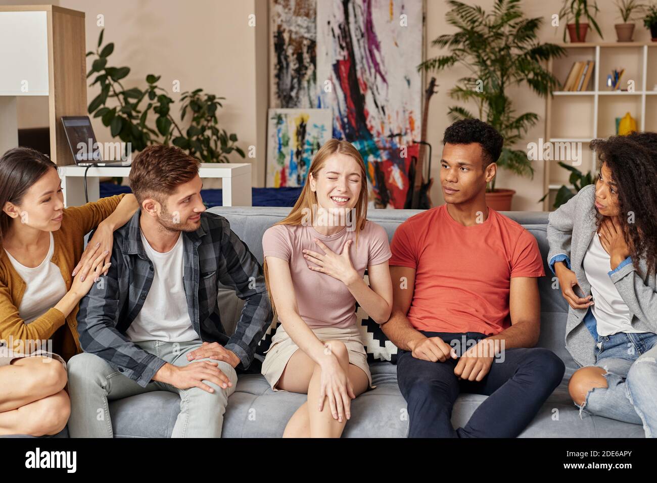 Chatting with friends. Group of young multicultural people in casual ...