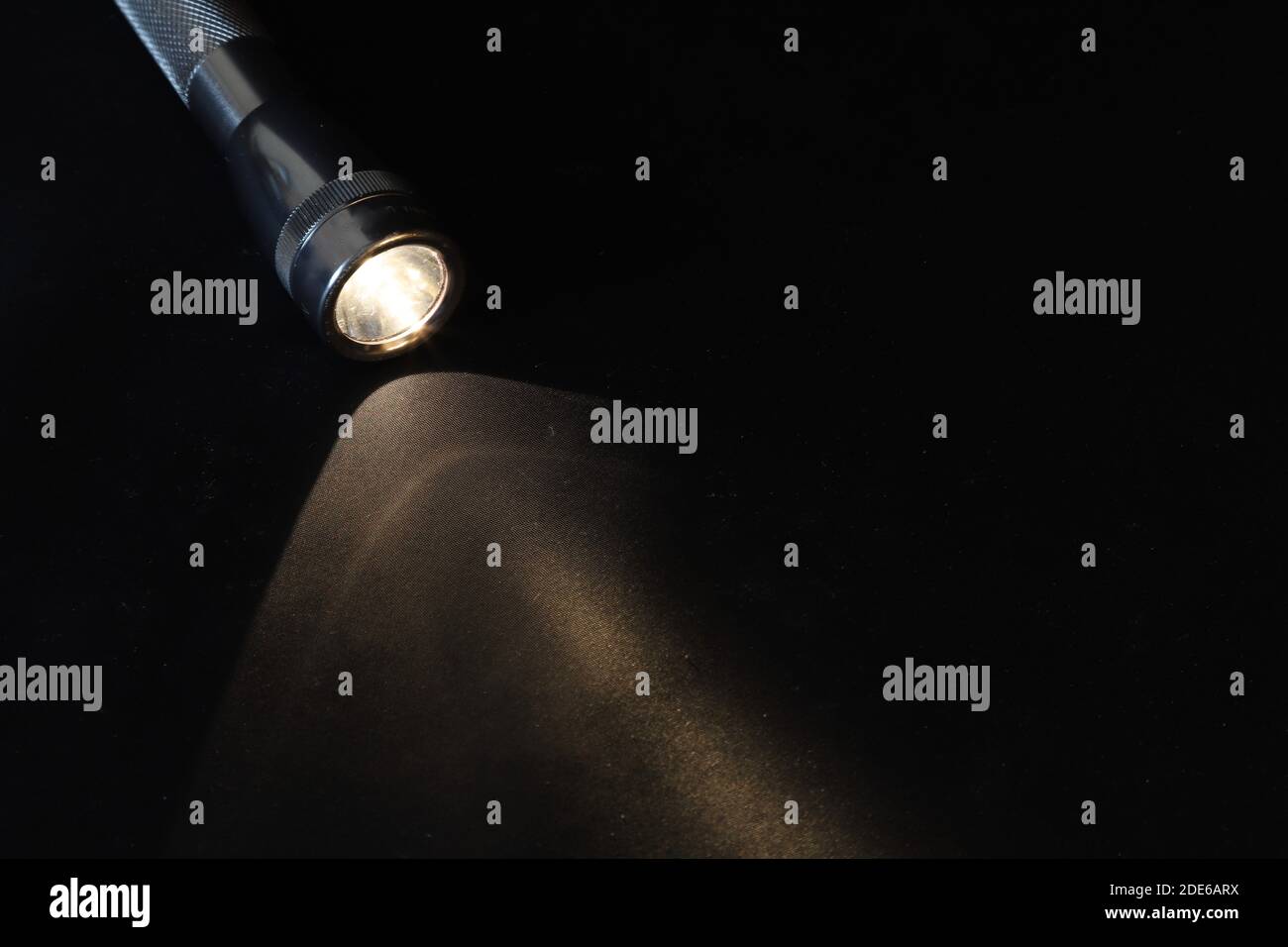 led torch shining on black Stock Photo - Alamy