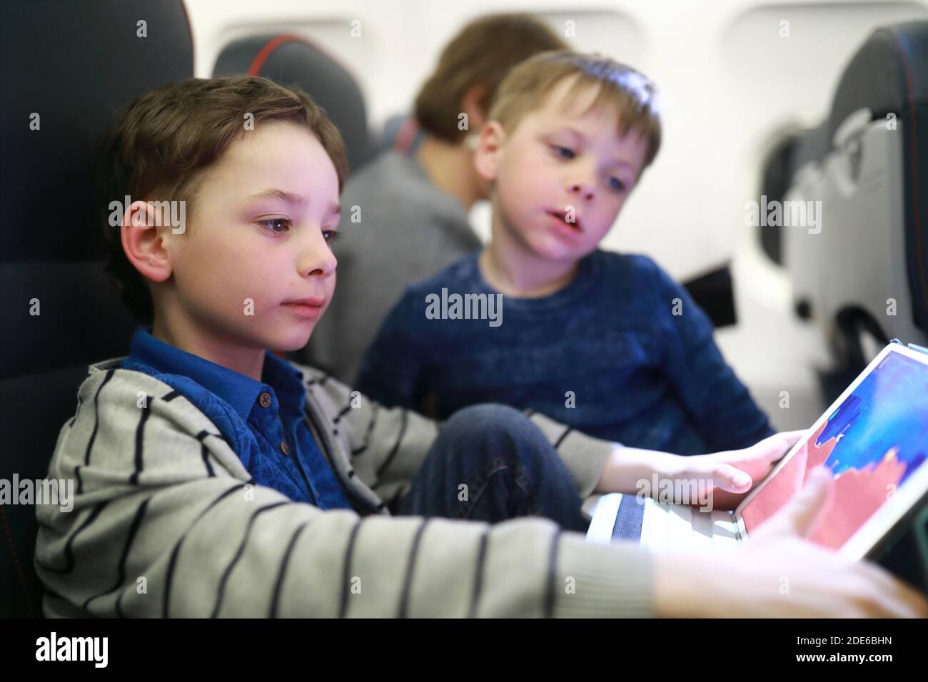 Kid playing tablet in night hi-res stock photography and images - Alamy