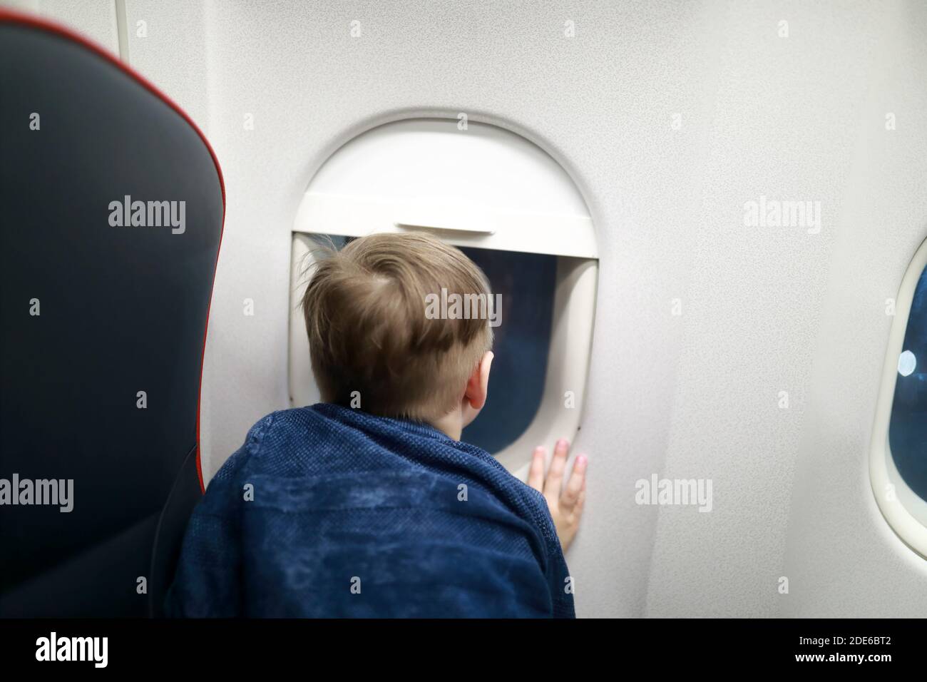 Child Looking Out Plane Window High Resolution Stock Photography and ...
