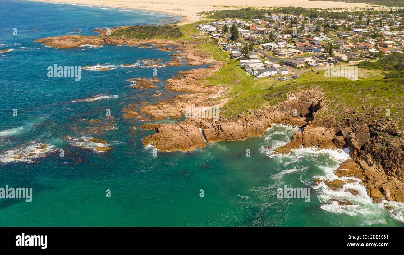 Aerial view of the Stockton Sand Dunes and blue water of the Tasman Sea ...