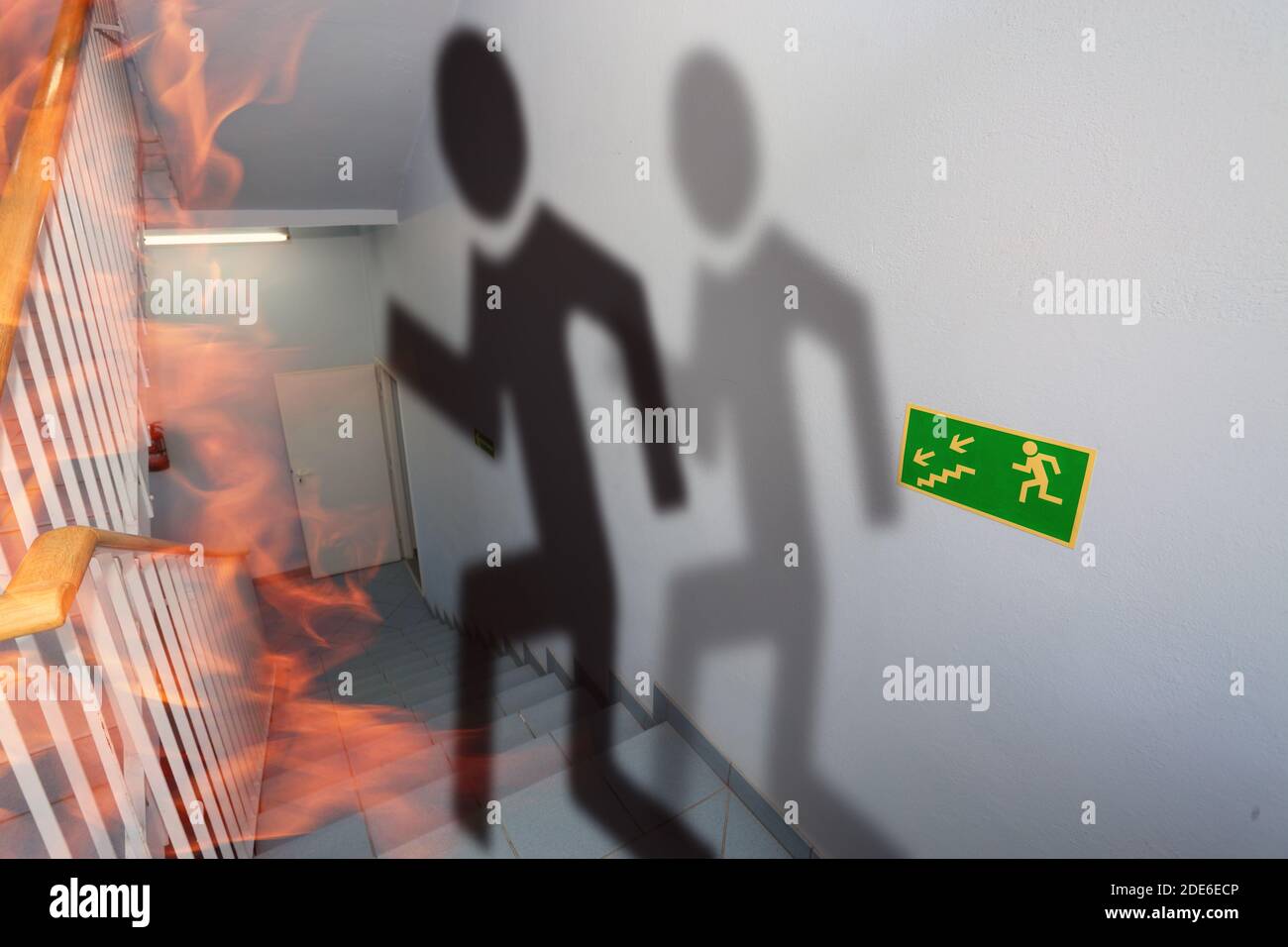 emergency exit and person symbol escaping from fire symbol Stock Photo ...