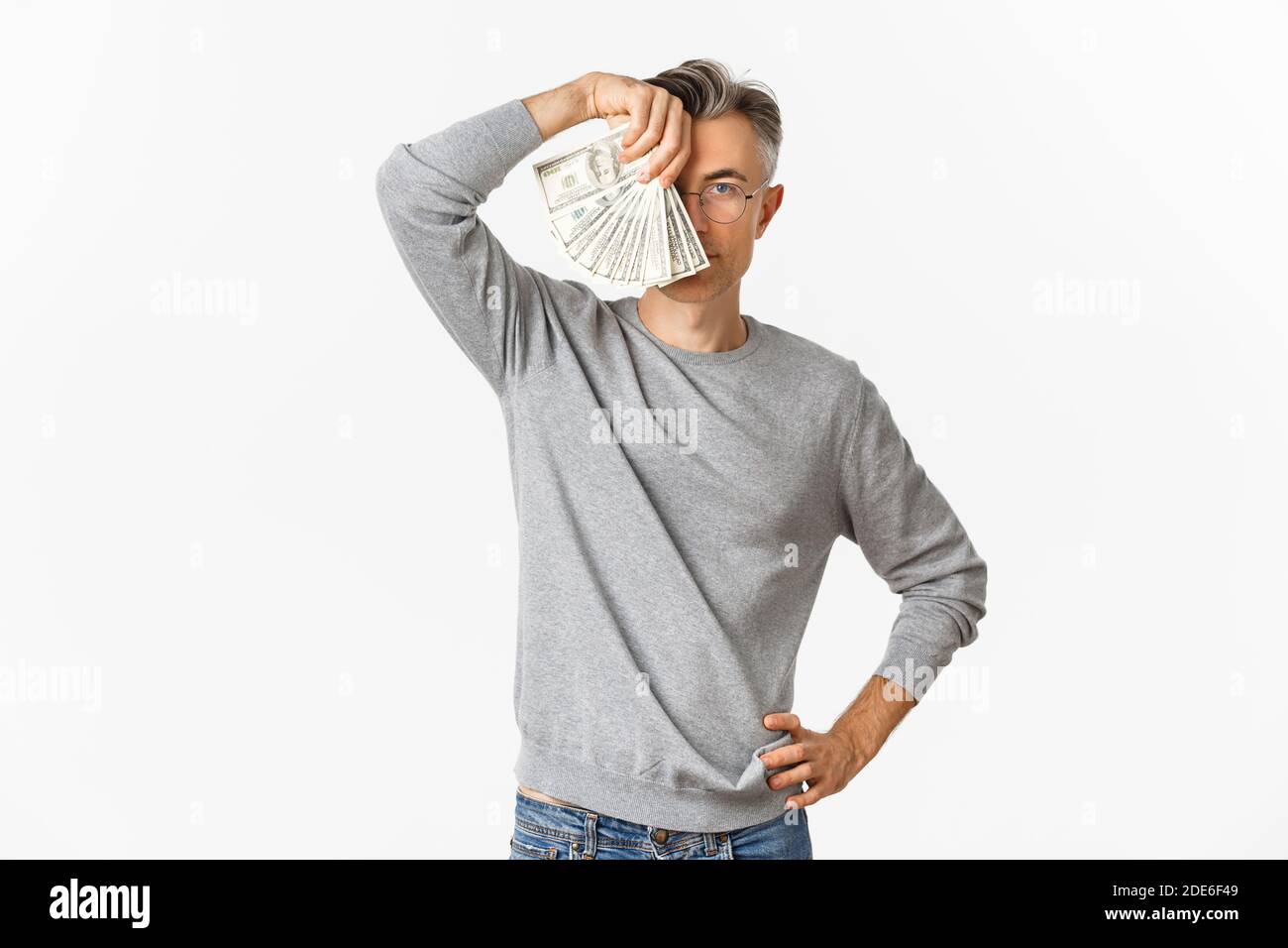 Portrait of successful and rich middle-aged man in gray sweater ...