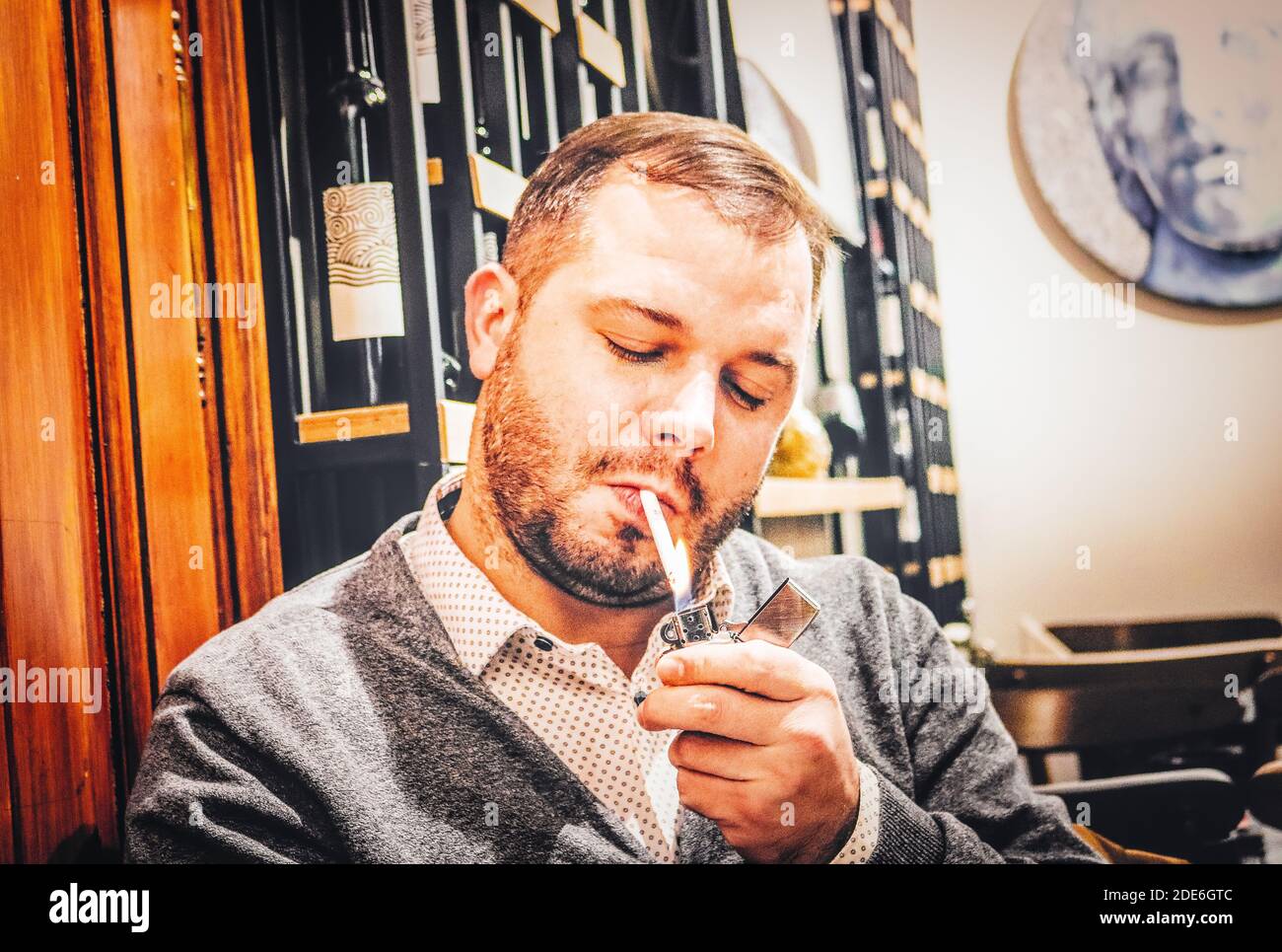 A men lighting the cigarette Stock Photo - Alamy