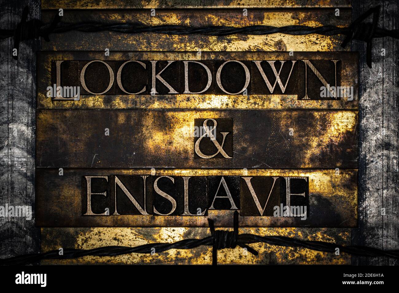 Lockdown and Enslave text on textured grunge copper and vintage gold ...
