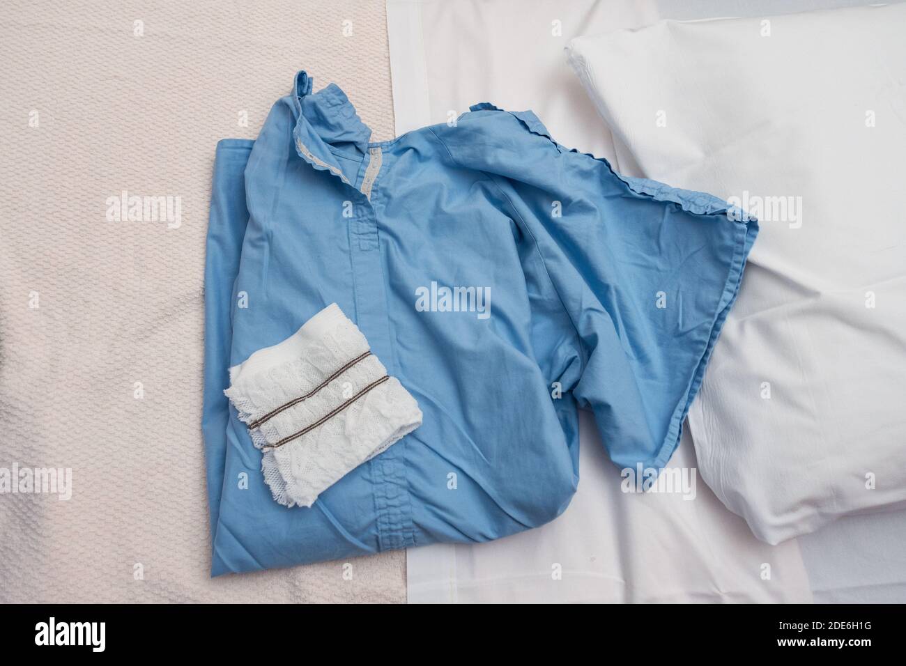 A Blue medical operation shirt and white operation underware lying on a ...
