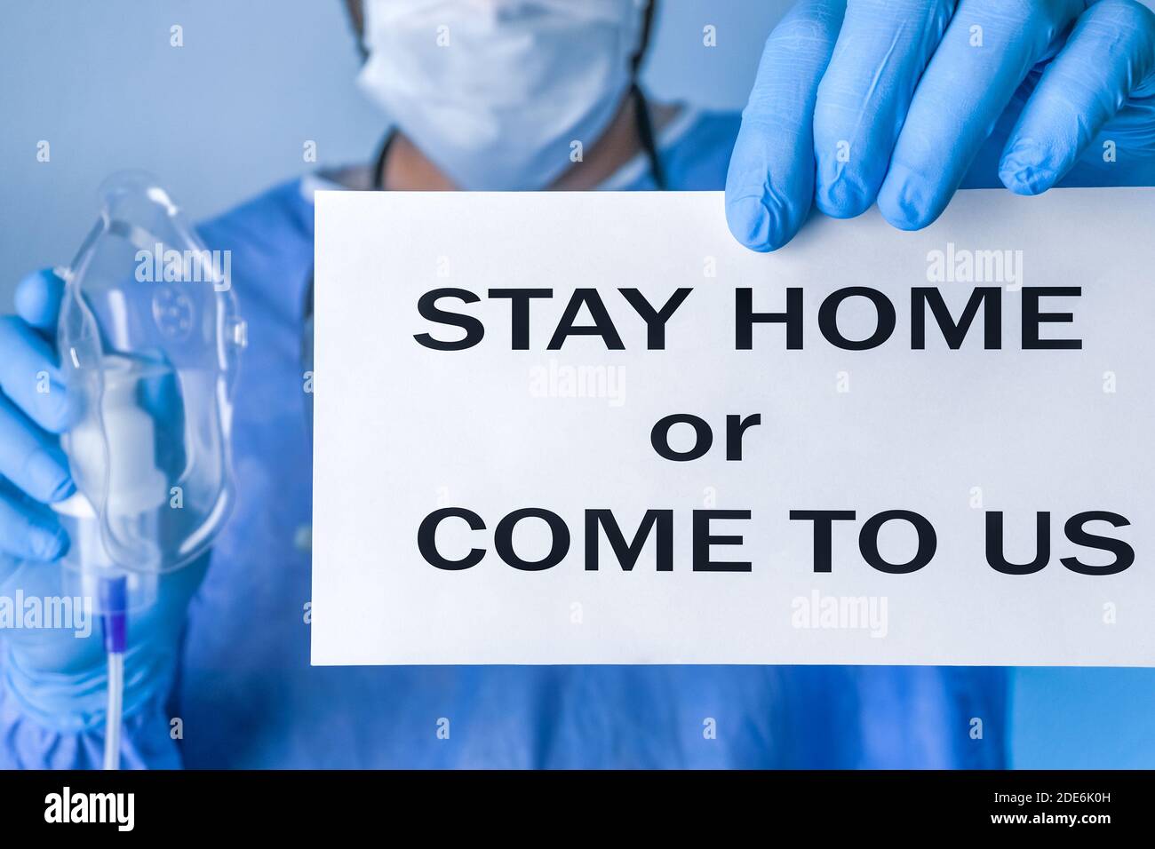 Stay home concept. Doctor holding oxygen mask in his hand. Coronavirus ...