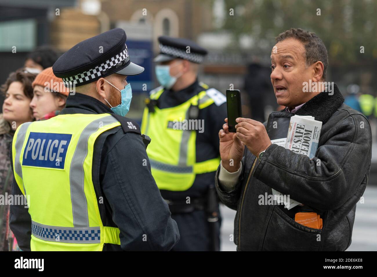 Phone recording police officer hi-res stock photography and images - Alamy