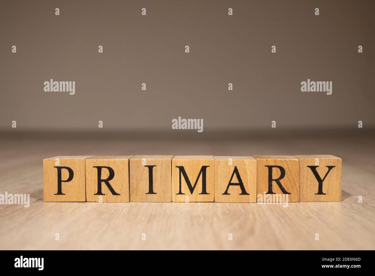 long word primary from gray wooden small letters with black font on an ...