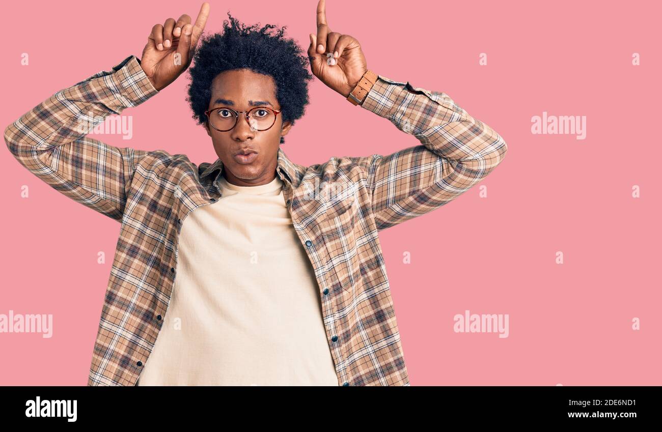 Handsome african american man with afro hair wearing casual clothes and ...