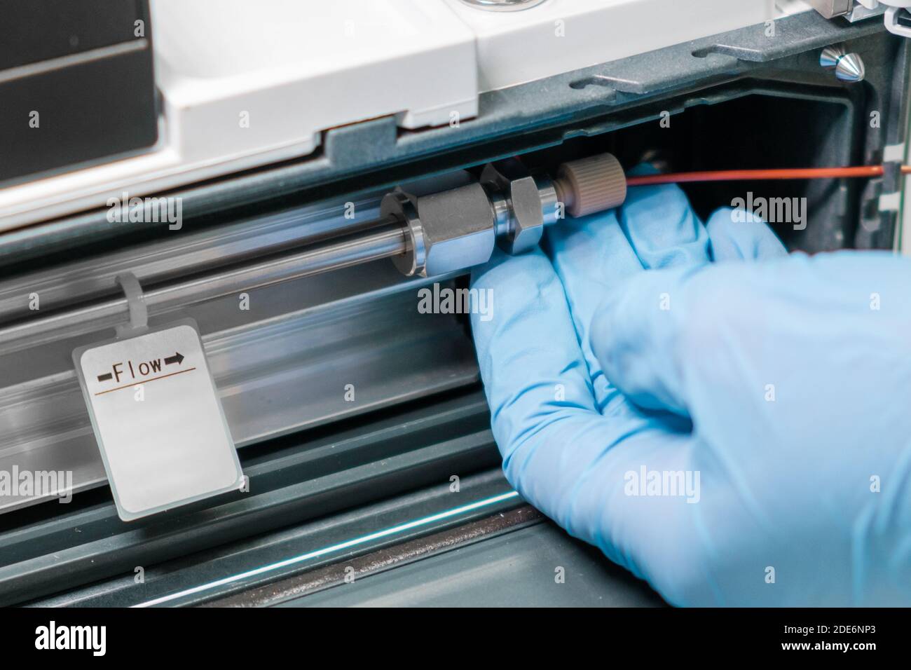 Close up scientist changing a column in HPLC system. Analytical ...