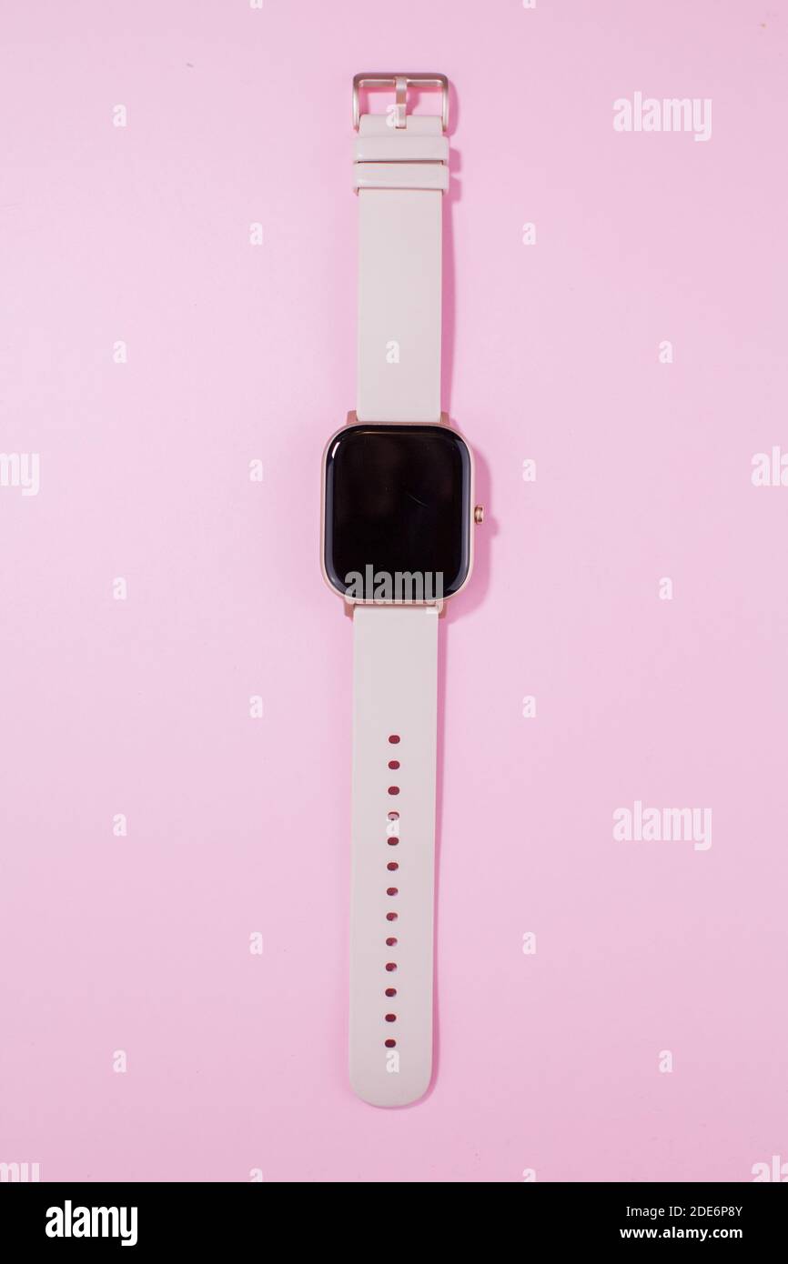 women smart watch on a pink background Stock Photo - Alamy