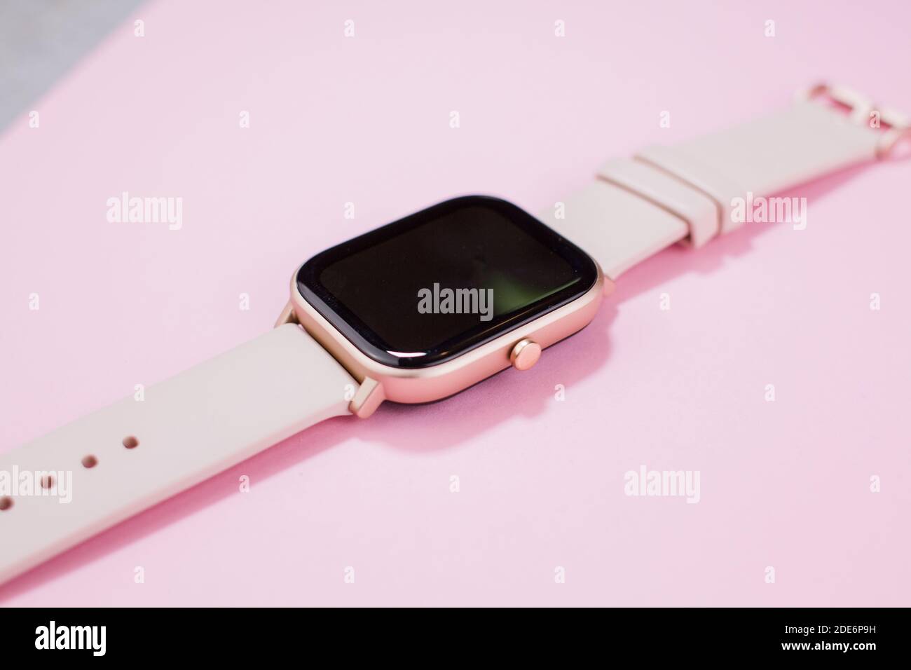 women smart watch on a pink background Stock Photo - Alamy