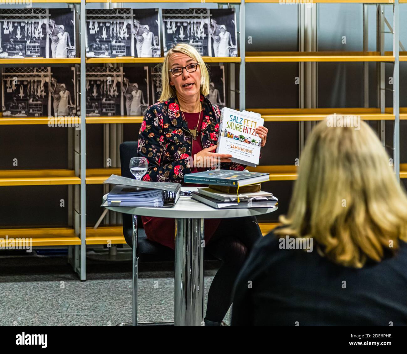 Reading of culinary books in the city library of Neuss, Germany Stock ...