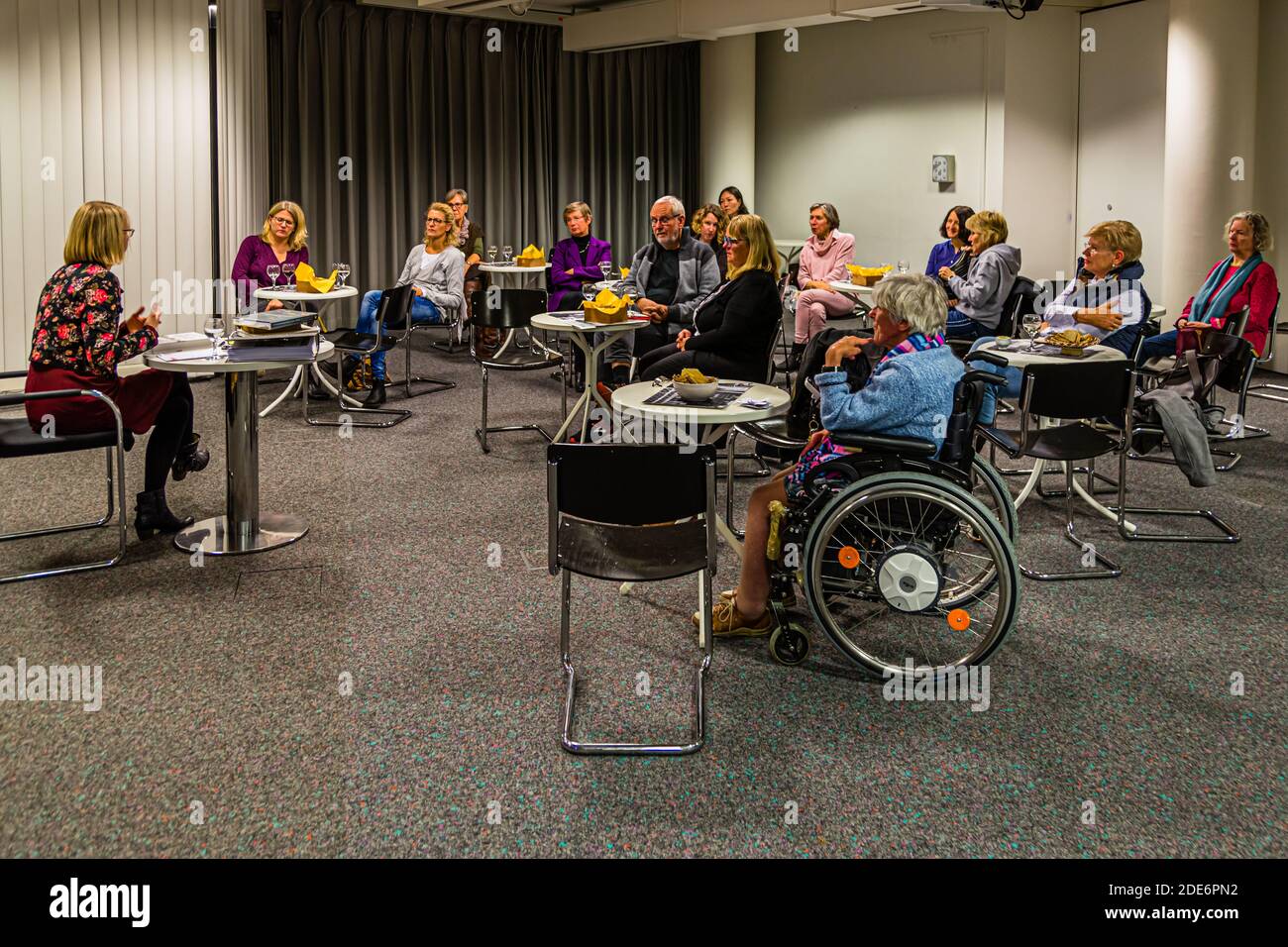 Reading of culinary books in the city library of Neuss, Germany Stock ...