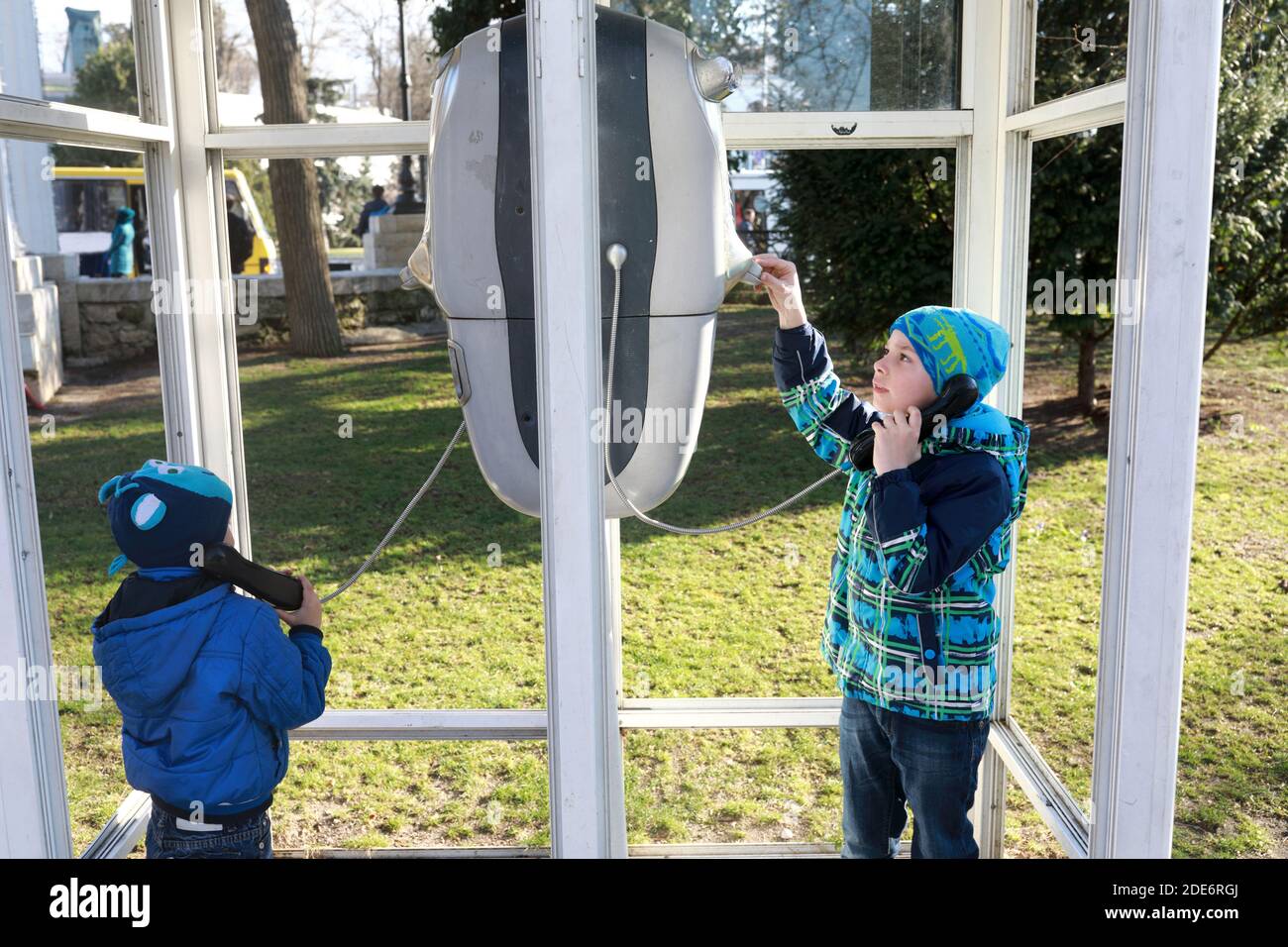 Two boys talking street hi-res stock photography and images - Alamy