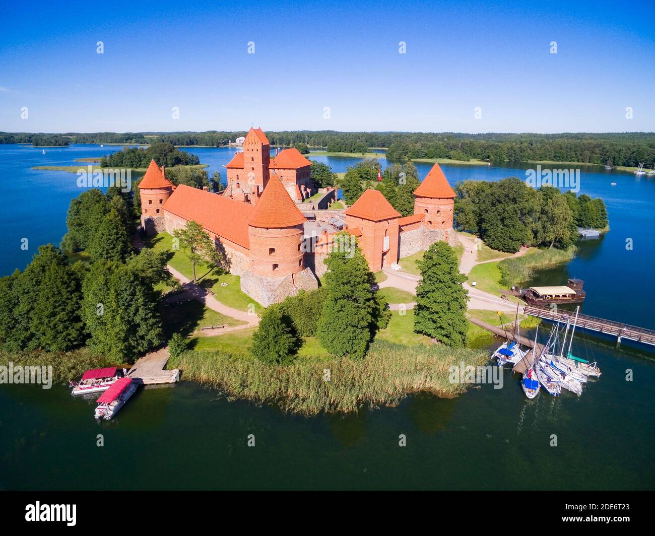 Aerial view of beautiful Gothic style red brick castle on an island on ...