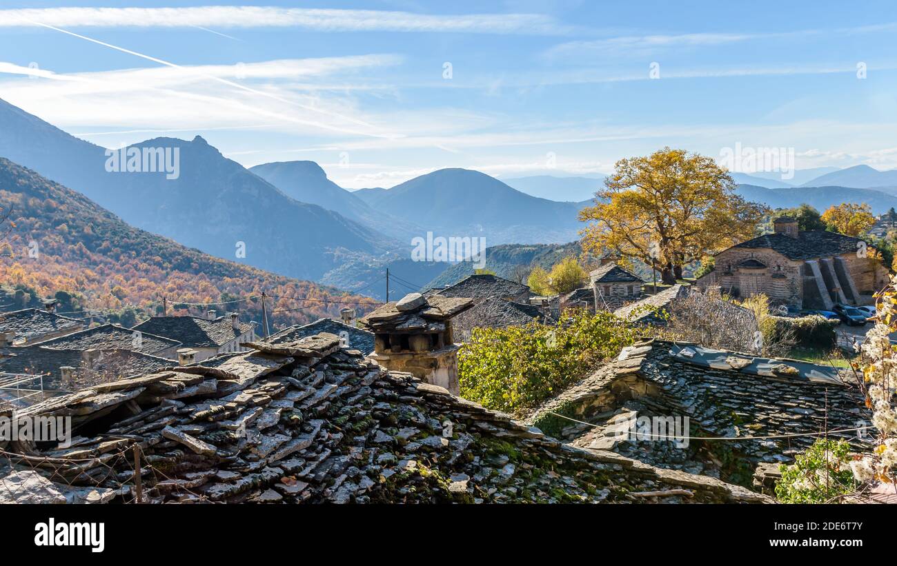 Traditional architecture with a stone built church during fall season ...